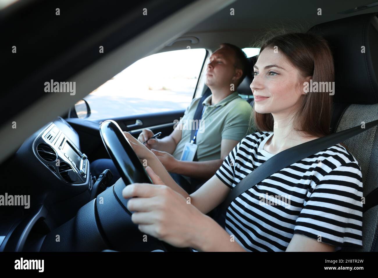 Driving school. Student passing driving test with examiner in car Stock ...