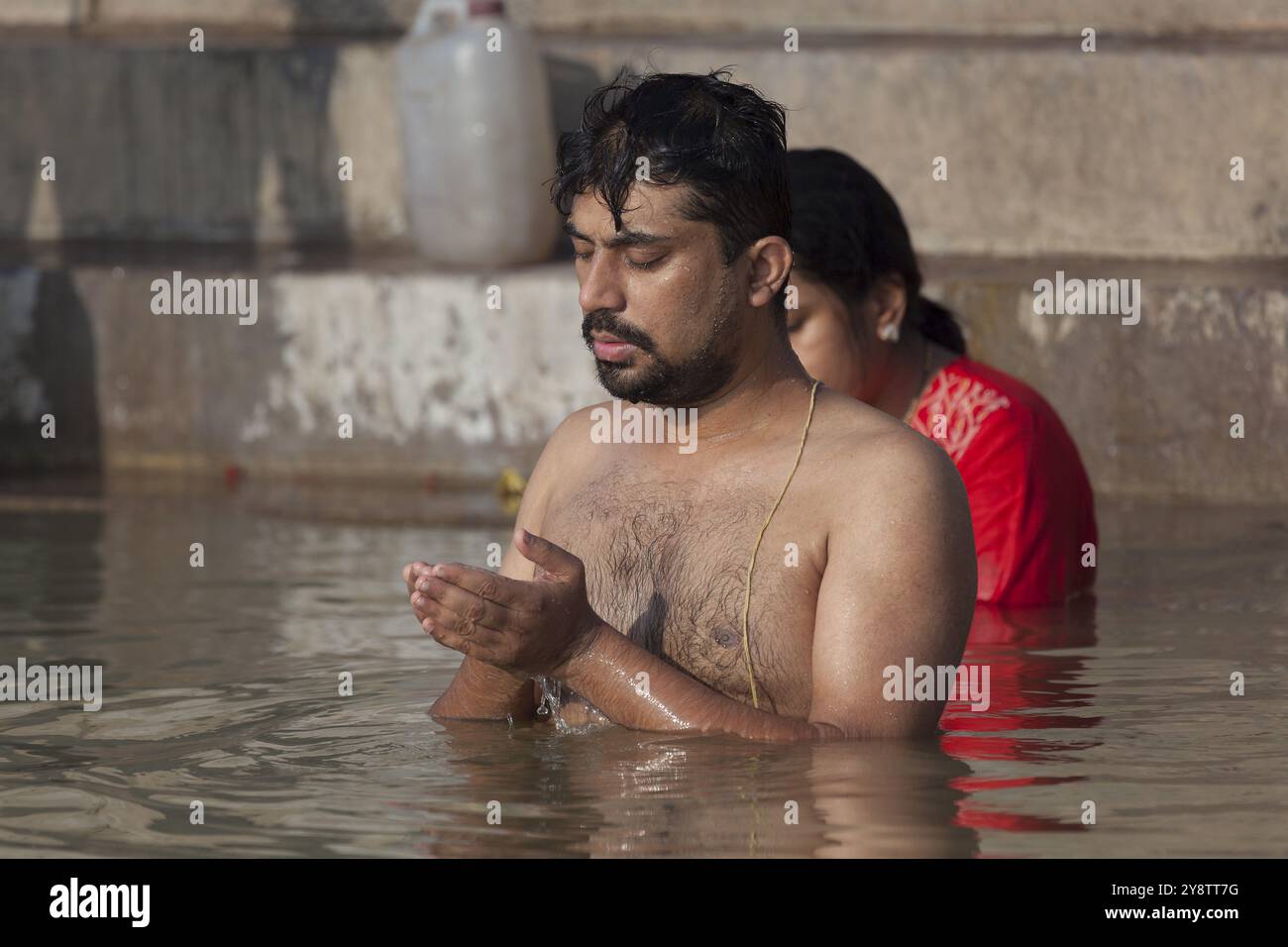 Pilgrims at ghat steps on river Ganges, Varanasi, Uttar Pradesh, India ...