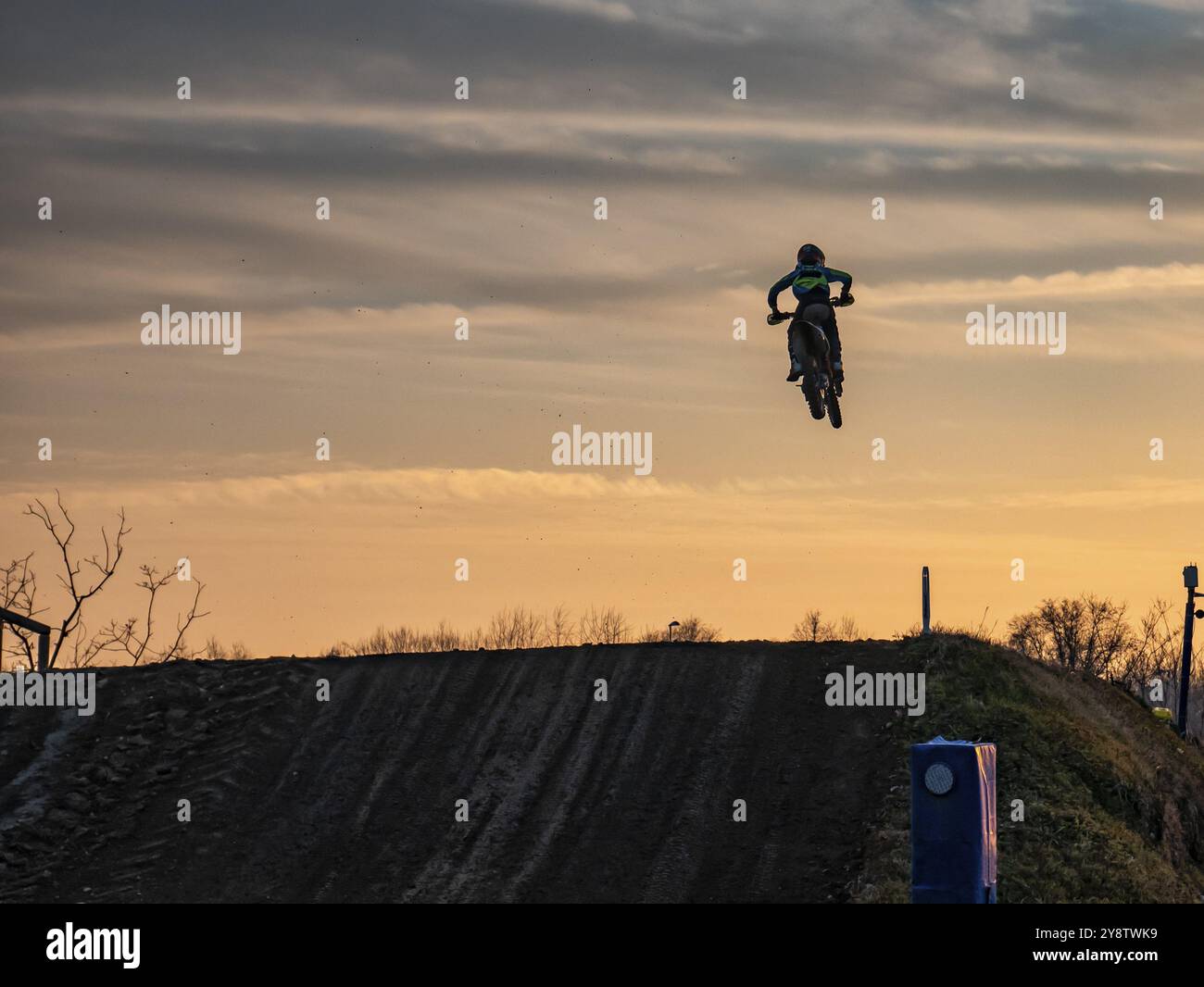 Motocross scene in sunset hours Stock Photo - Alamy