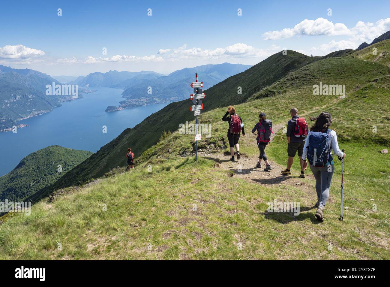 Trekking scene on Lake Como alps (the arrows indicates the names of the ...