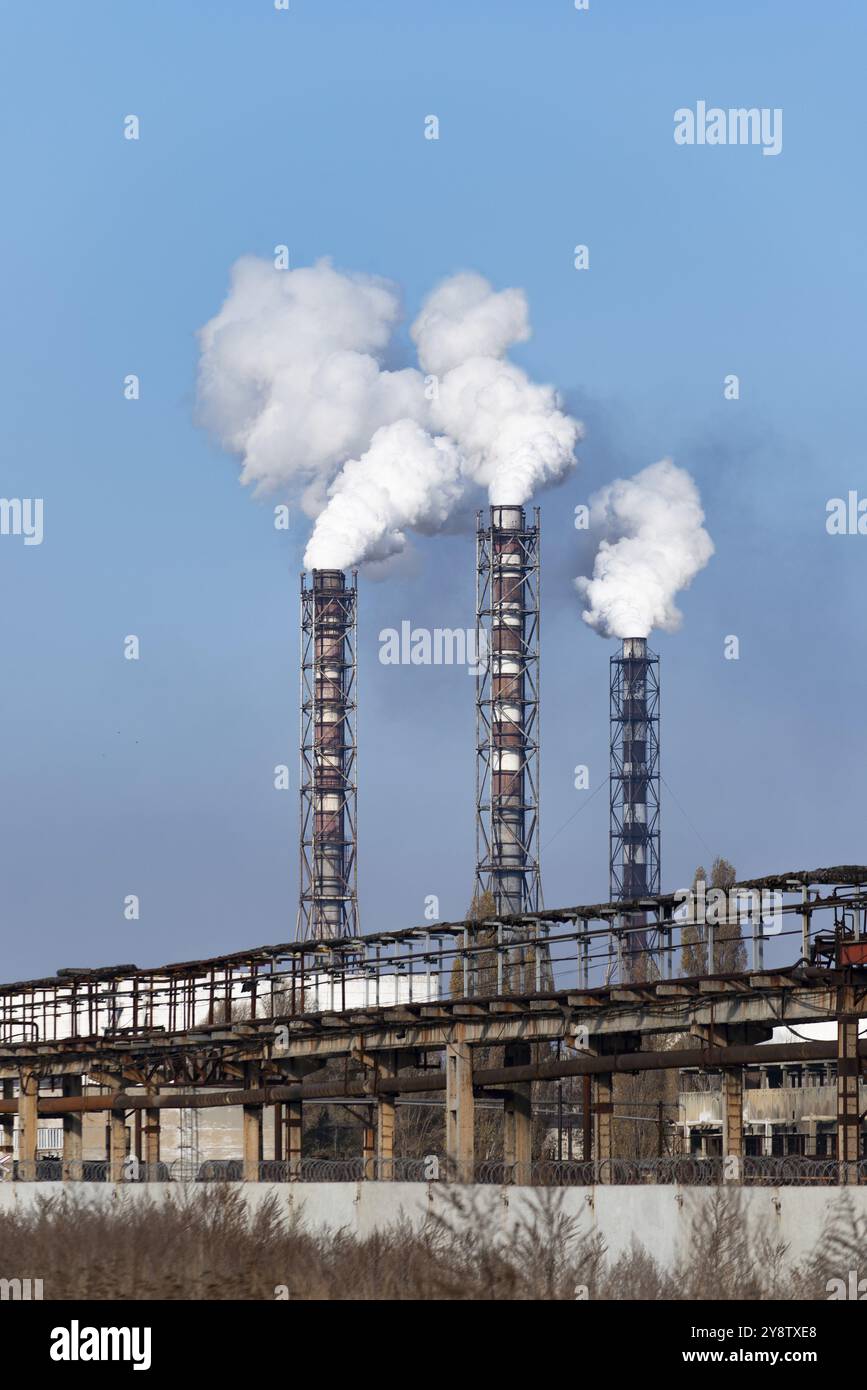 Smoke stack of coal power plant on blue sky background Stock Photo - Alamy