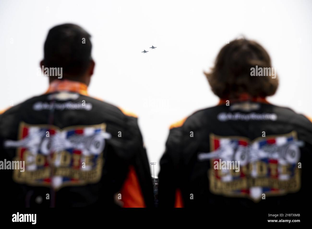 The crew of AJ Foyt Racing stand during the National Anthem prior to ...
