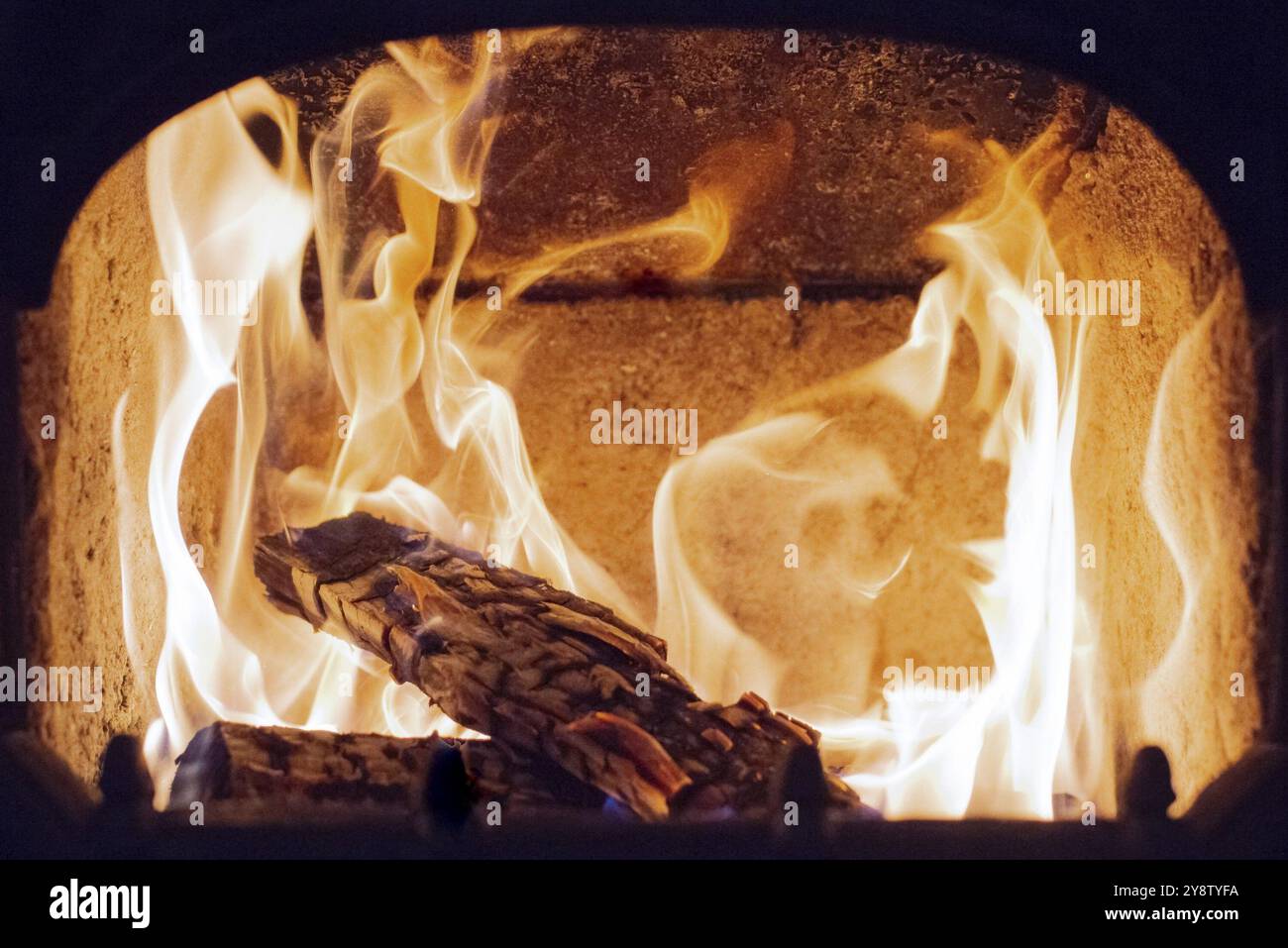 Flame of Wooden logs being burn inside stove Stock Photo - Alamy