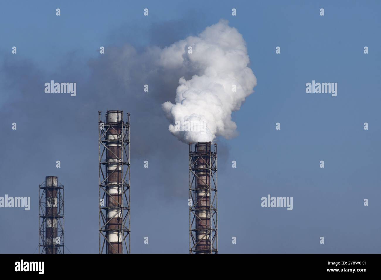 Smoke stack of coal power plant on blue sky background Stock Photo - Alamy