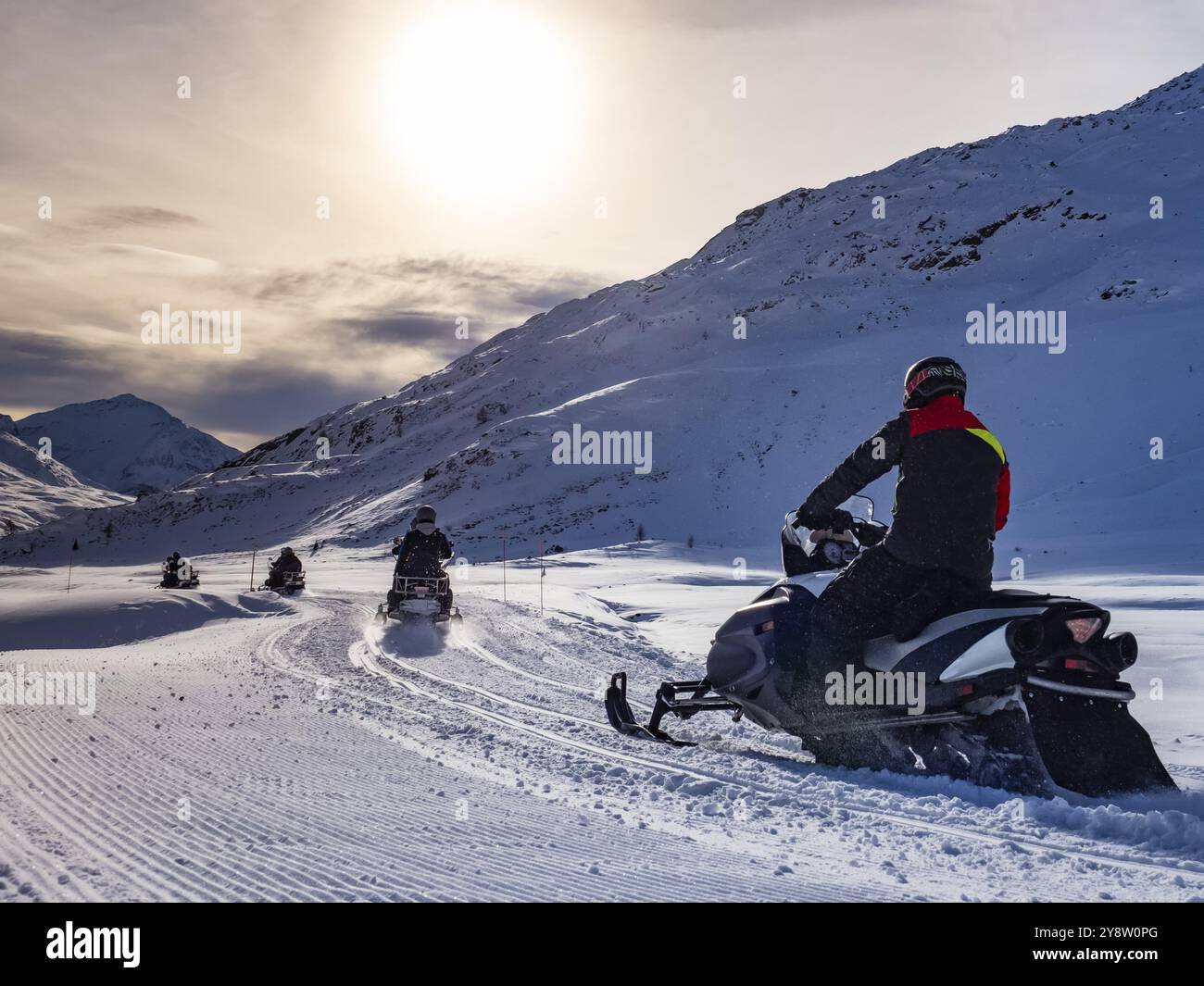 Snowmobile on a trail in the Italian alps Stock Photo - Alamy