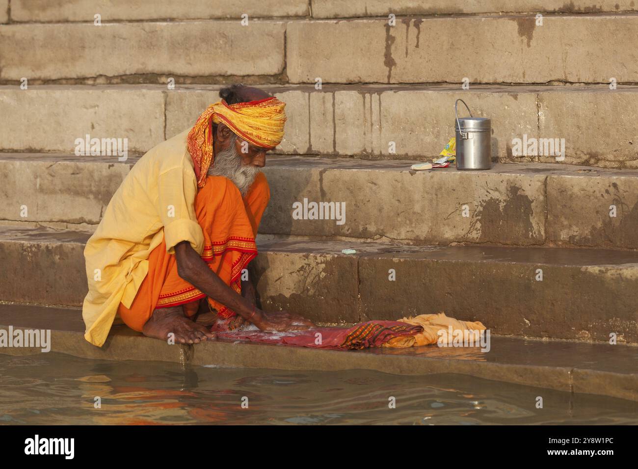 Pilgrim at ghat steps on river Ganges, Varanasi, Uttar Pradesh, India ...