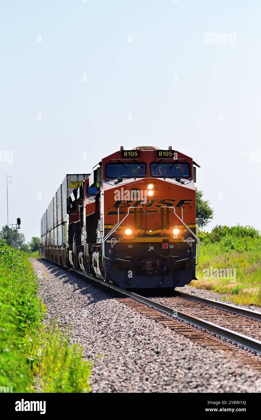 Lee, Illinois, USA. Three Burlington Northern Santa Fe locomotives lead an intermodal freight ...