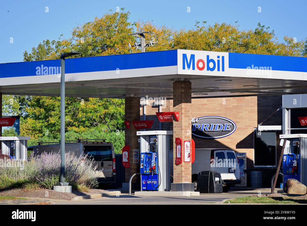 Wheaton, Illinois, USA. Gas pumps on service islands at a self-service ...