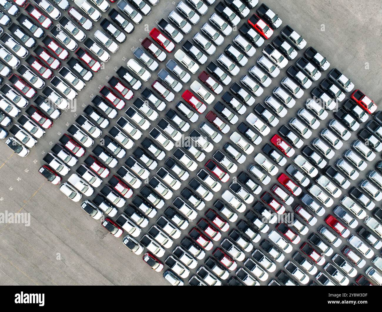 Aerial view of new cars stock at factory parking lot. Above view cars ...