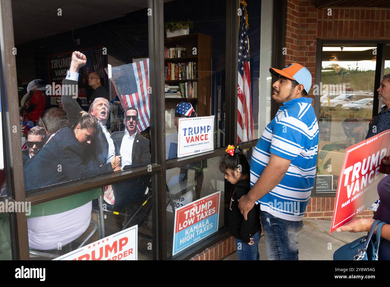 Woodstock, Georgia, USA. 6th Oct, 2024. A local Hispanic supporter of ...