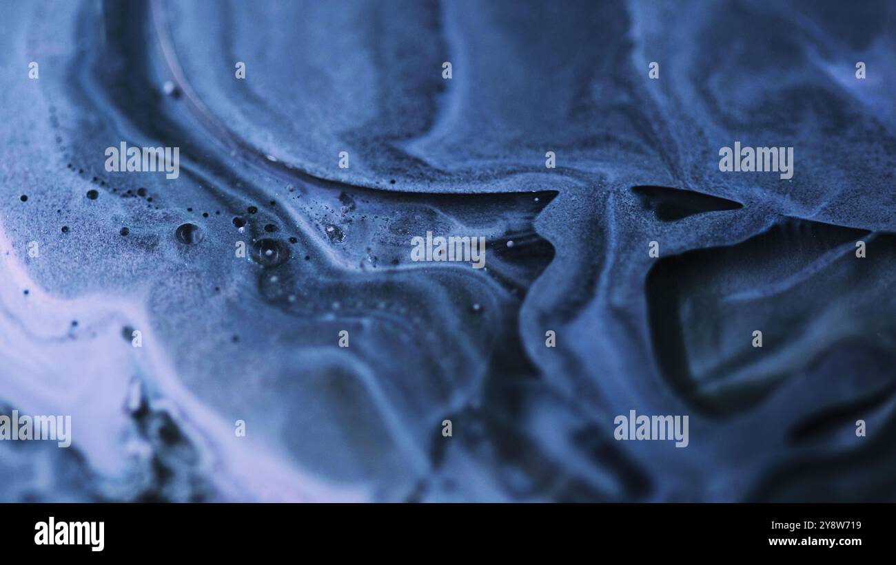 Fluid glitter drip. Bubble paint spill. Defocused blue black white ...