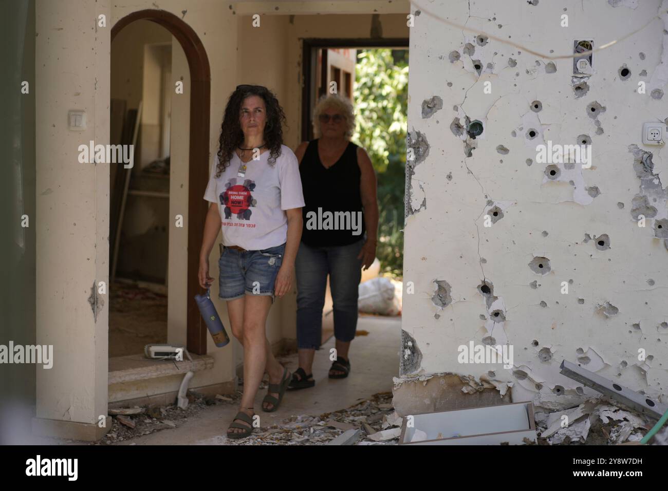 Liora Eilon, right, walks through her home that was destroyed by an ...