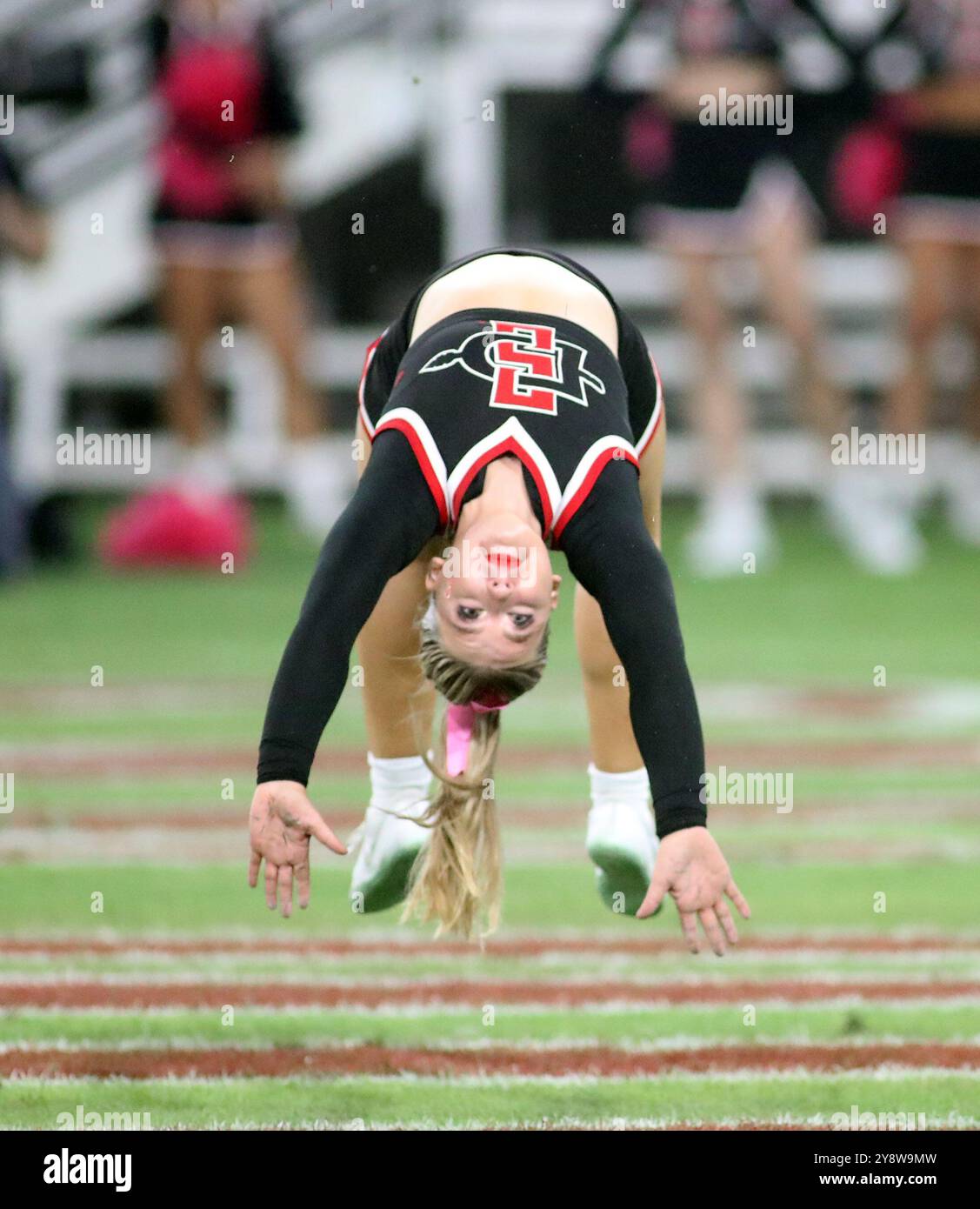 October 5, 2024 - San Diego State Aztecs cheerleader does backflip ...