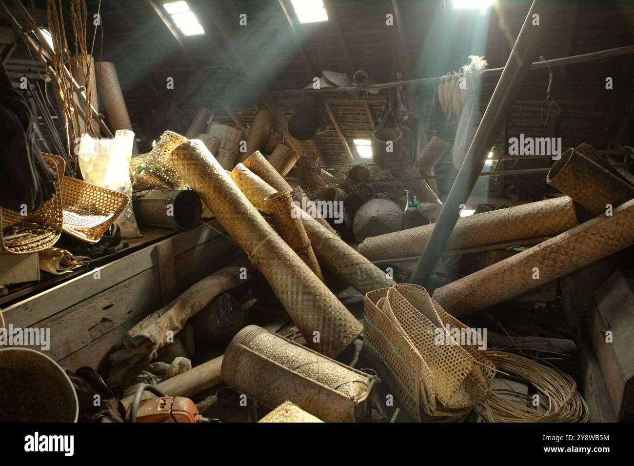 Mats, rattan bags, conical hats and other things are stored at the ...