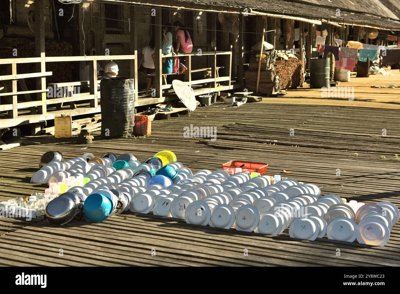Plates being dried in the sun after a welcome ceremony during an ...
