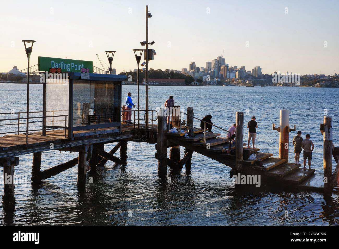 Recreational fishermen fishing from the McKell Park ferry wharf on ...