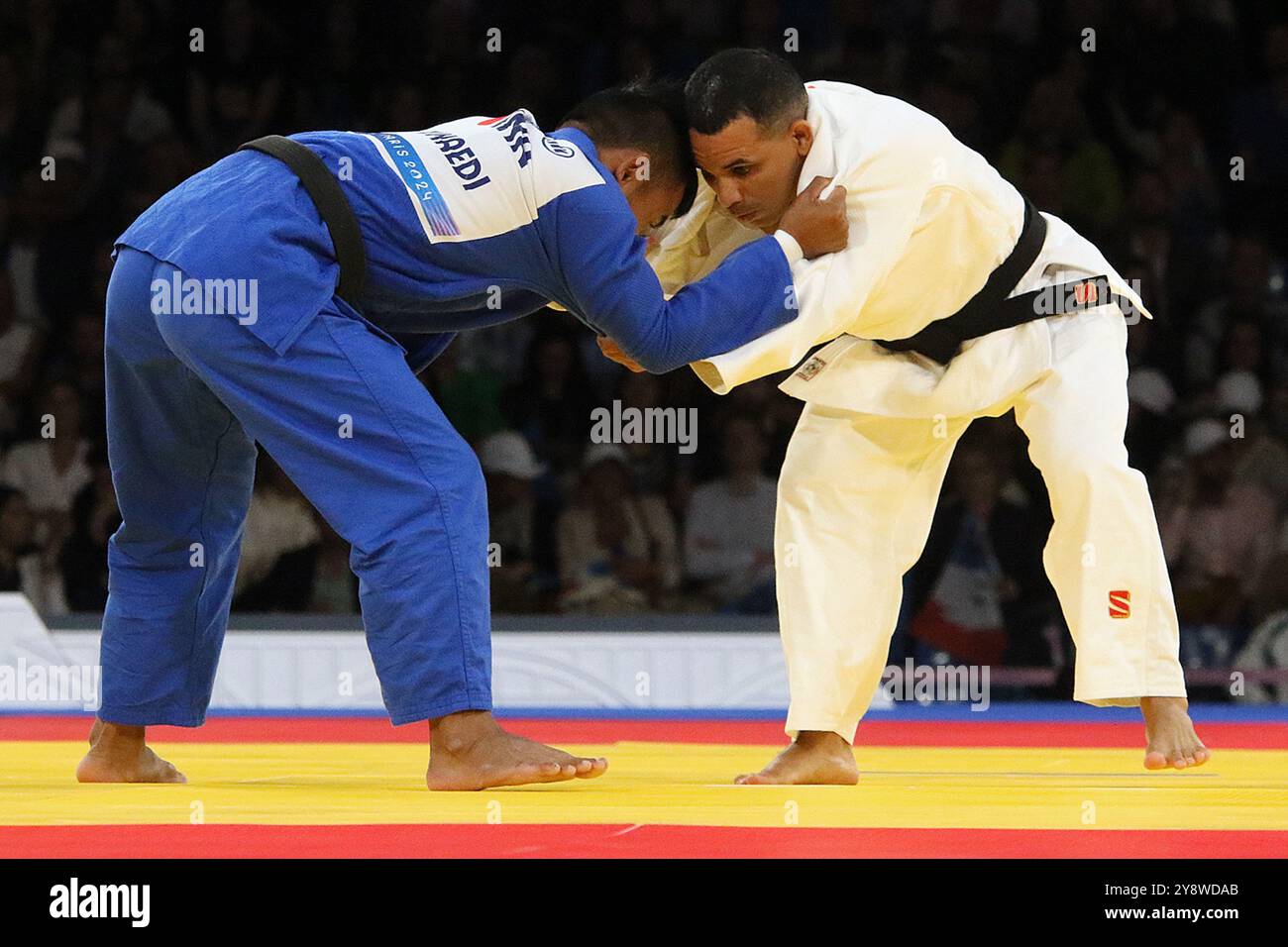 Marcos Dennis BLANCO of Venezuela (white) gets bronze vs JUNAEDI of ...