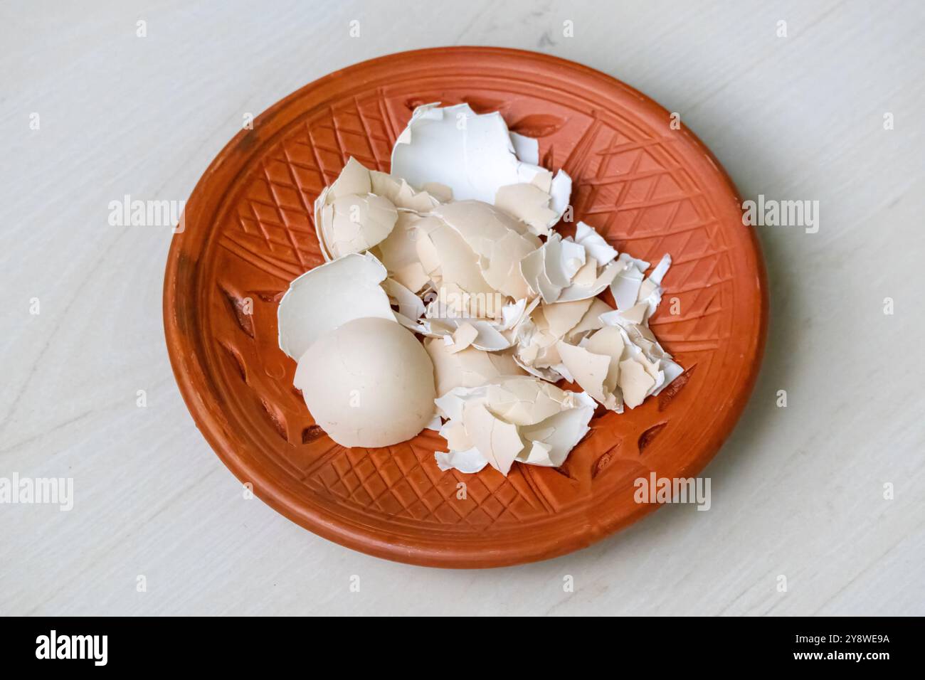 Broken egg shells in a clay plate. Recycling kitchen waste, Crushed egg ...