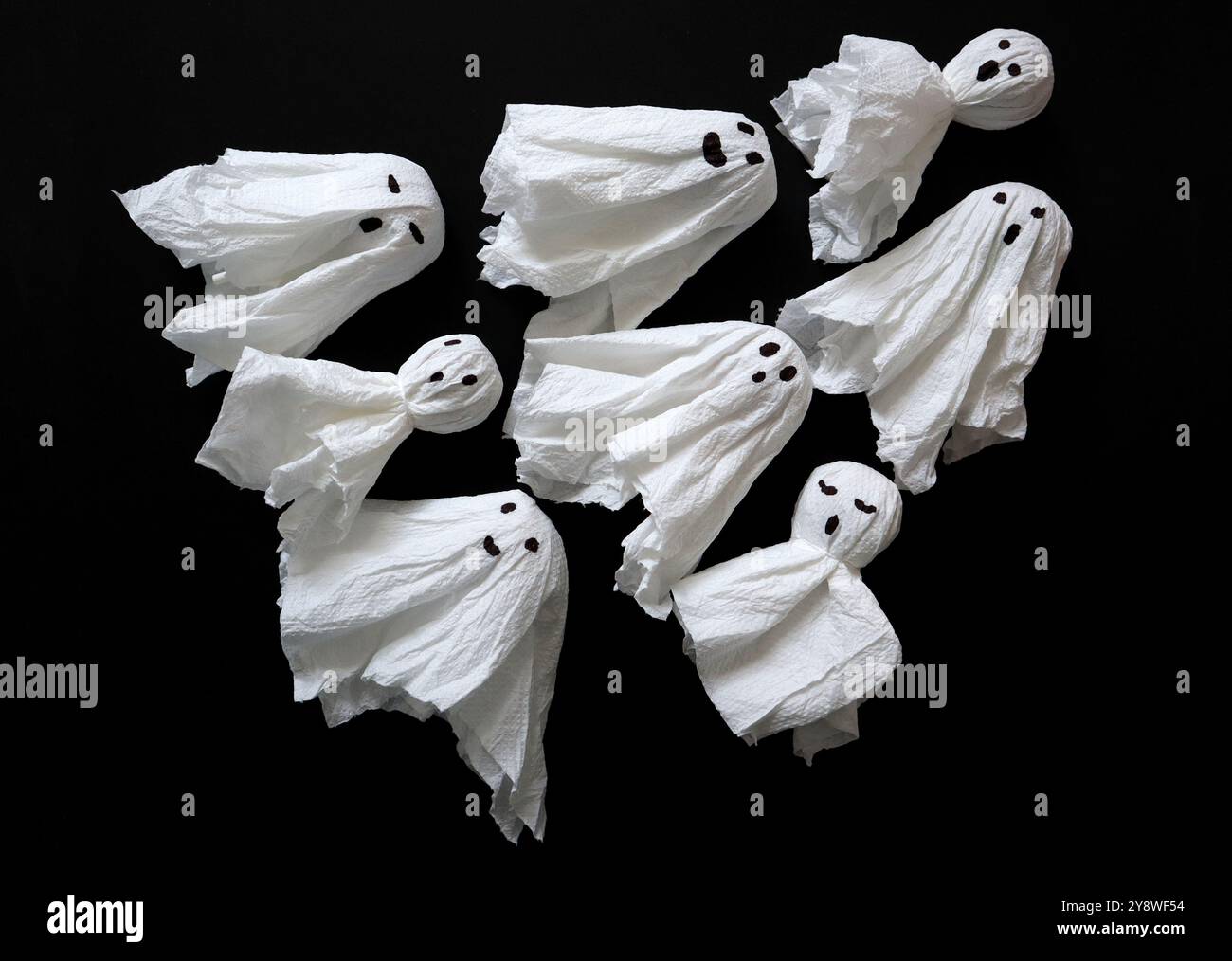 Set of ghosts on black background. Handmade from napkins. Different ...