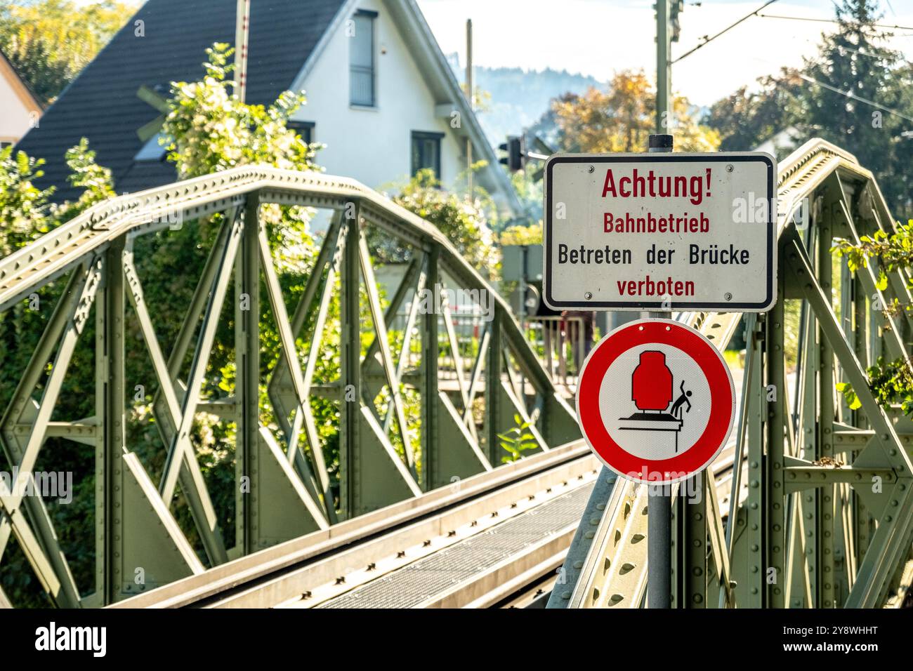 German sign on a train bridge warning people from falling of the bridge ...