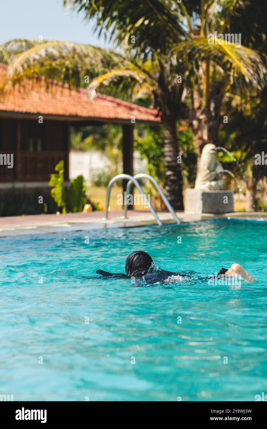 Relaxed Woman Floating in a Sparkling Pool. Summer Poolside Oasis with ...