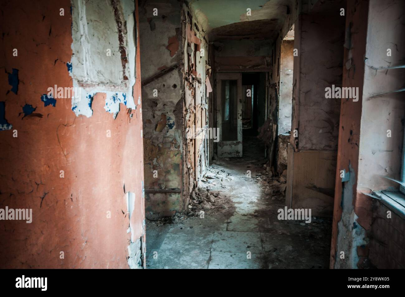 Abandoned Corridor of a Decaying Structure with Faded Walls and ...