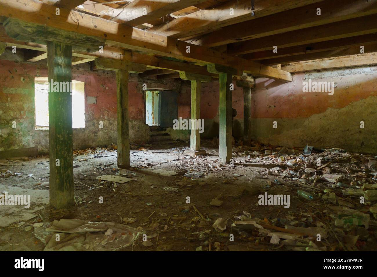 Abandoned Interior of a Dilapidated Building with Mossy Pillars and ...