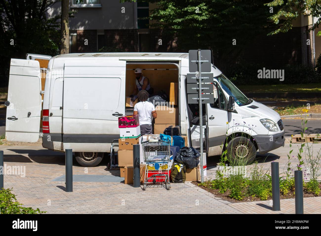 Moving Day Essentials: Loading a Van with Boxes Stock Photo - Alamy