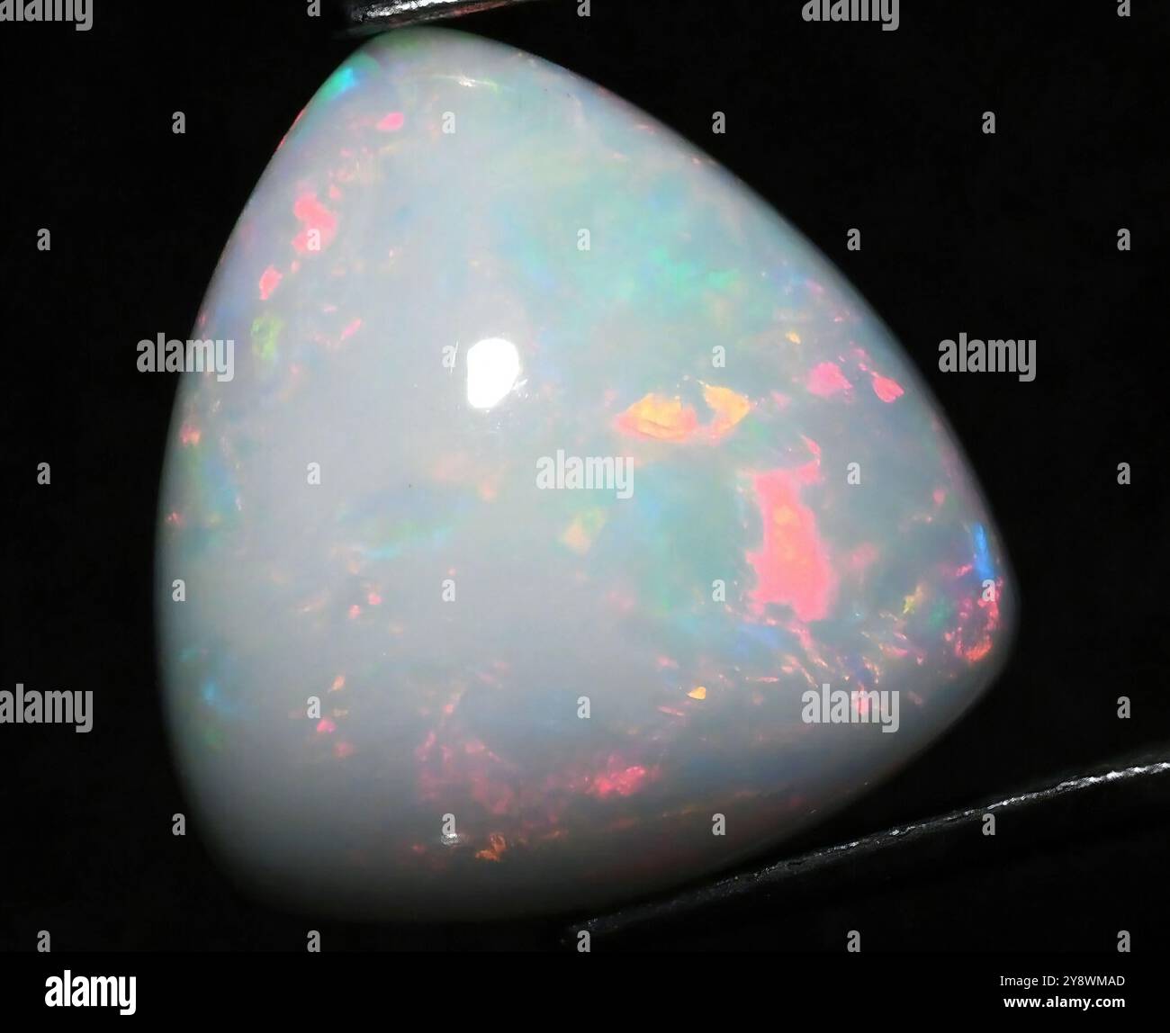 Beautiful Triangular Opal with Iridescent Colors and Smooth Surface ...