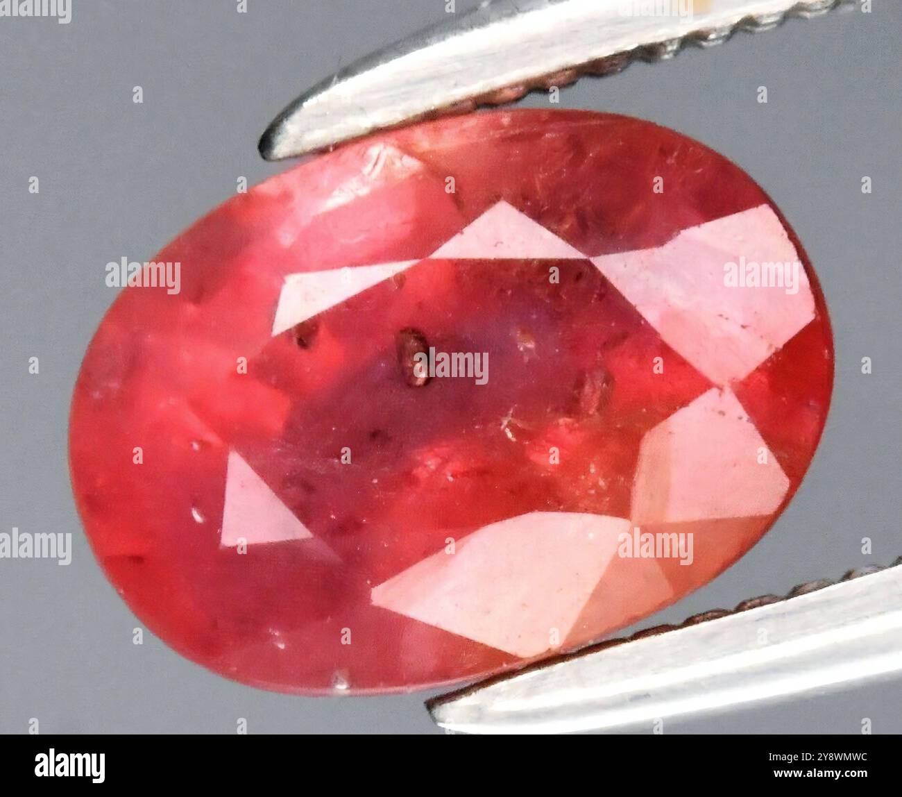 Radiant Red Ruby Gemstone Captured in Glimmering Light Stock Photo - Alamy