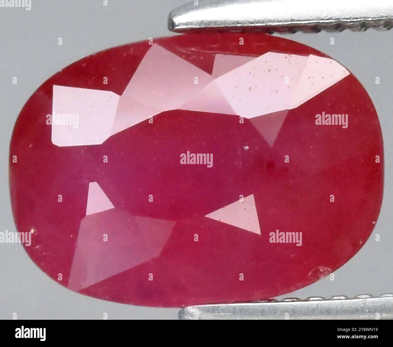 Radiant Deep Pink Ruby Gemstone with Faceted Surface Stock Photo - Alamy