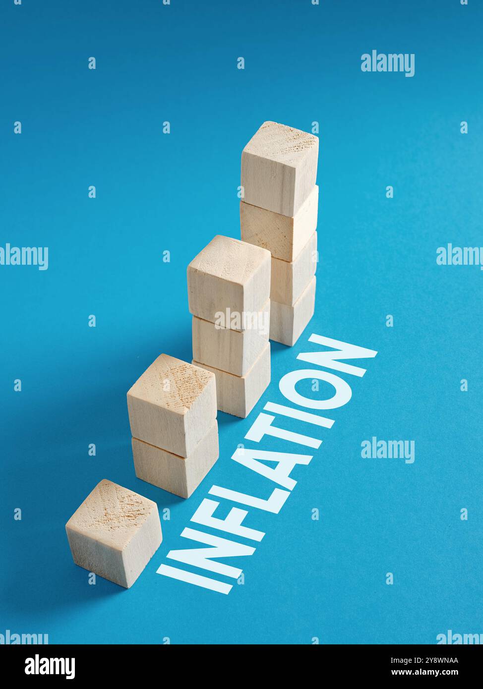 Wooden blocks forming a rising chart symbolizing increasing inflation ...