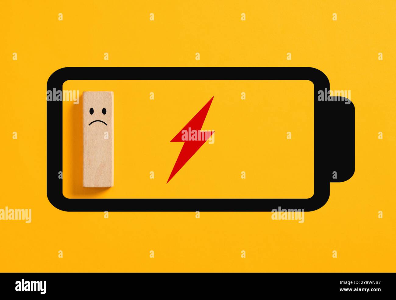 Sad wooden block character showing low energy with empty battery icon ...