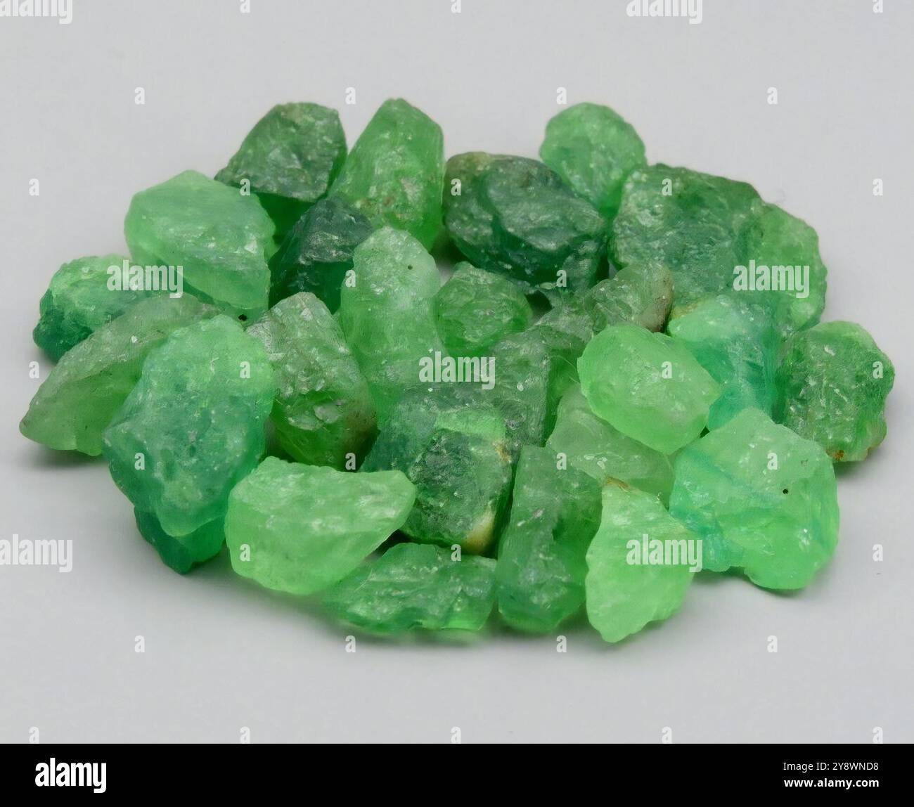 A Lush Collection of Brilliant Green Stones Glimmering Under Soft Light ...