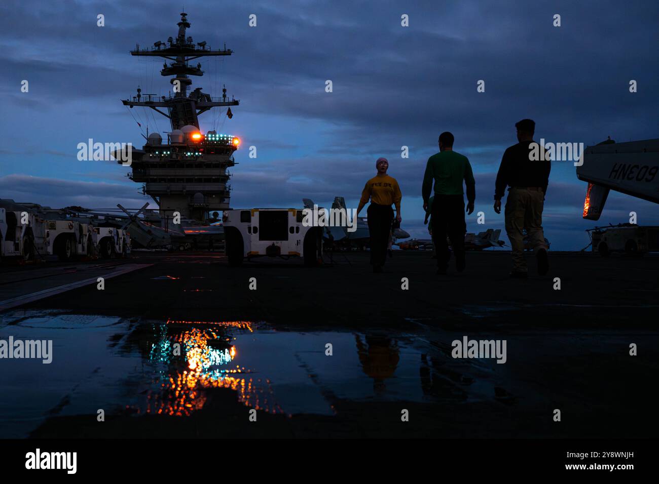 PACIFIC OCEAN (Oct. 2, 2024) The U.S. Navy Sailors transit the flight deck aboard the Nimitz ...