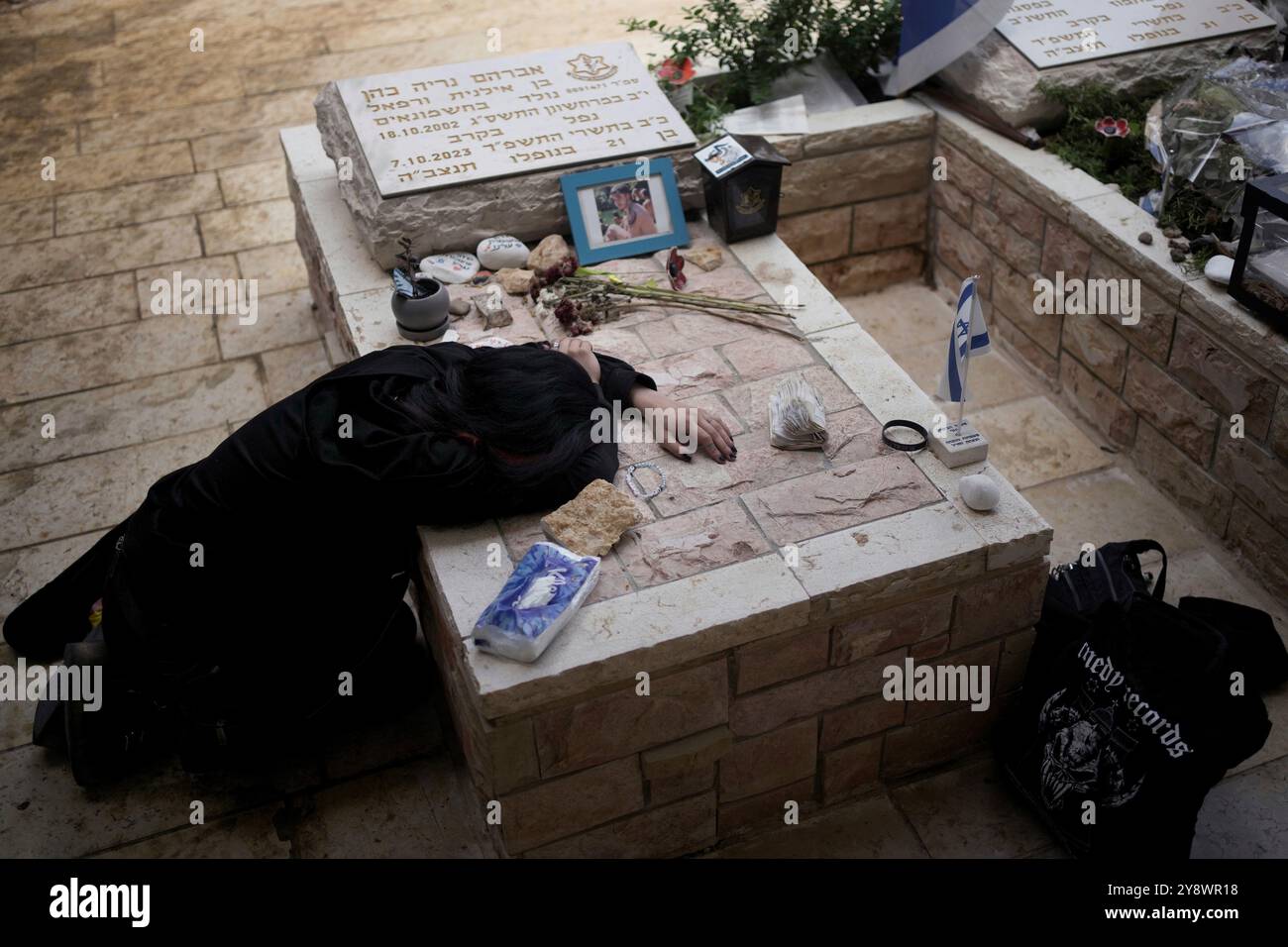 Sara Chen weeps over the grave of her longtime friend, Staff Sergeant ...