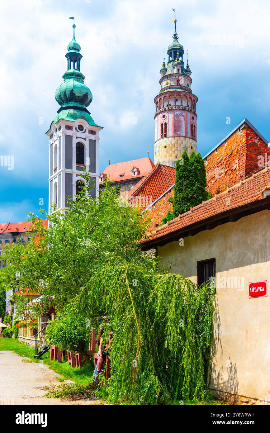 The iconic towers of Cesky Krumlov Castle rise prominently against a ...