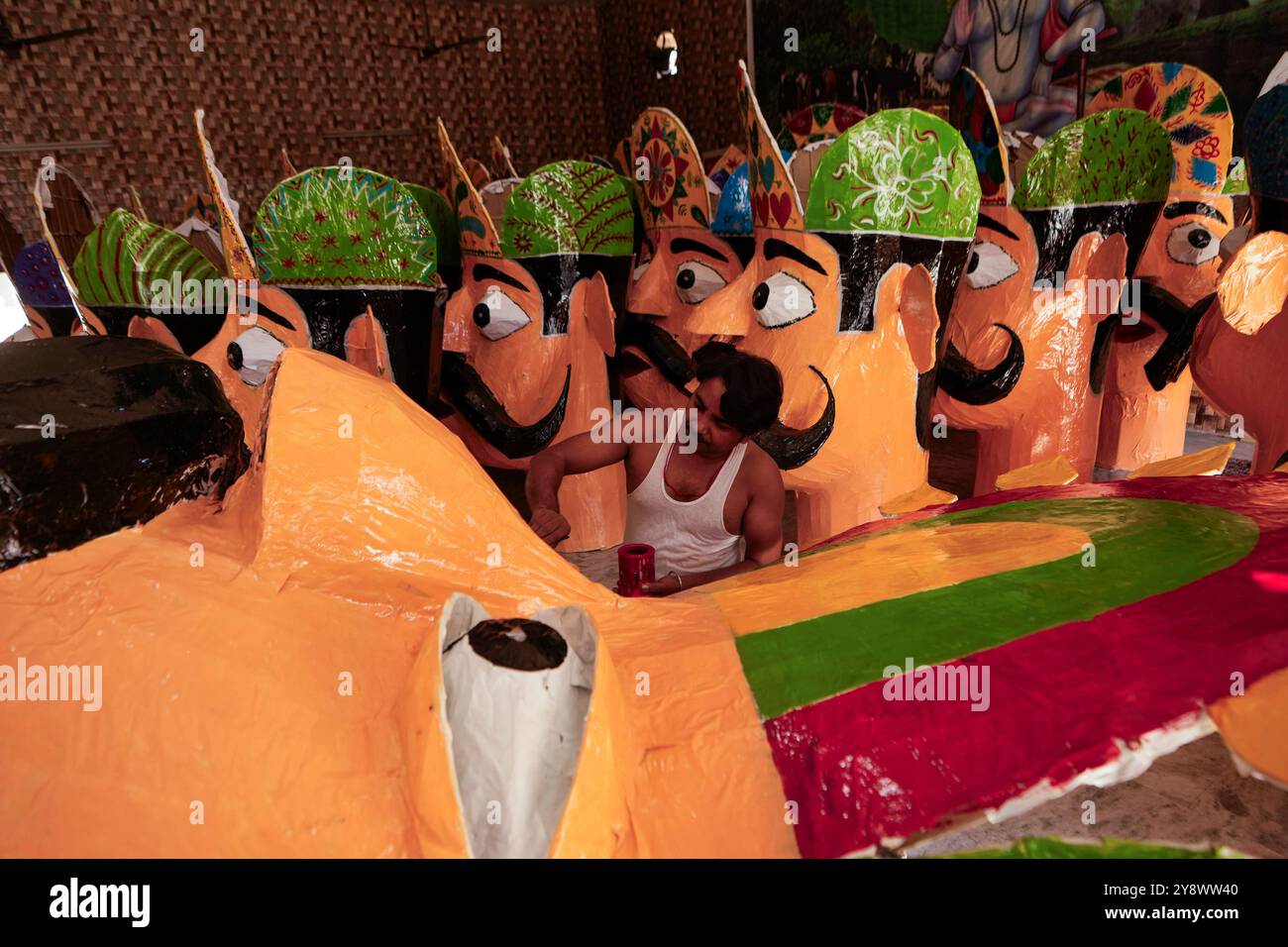 An Indian artist makes effigies of the antagonists in the Hindu epic ...