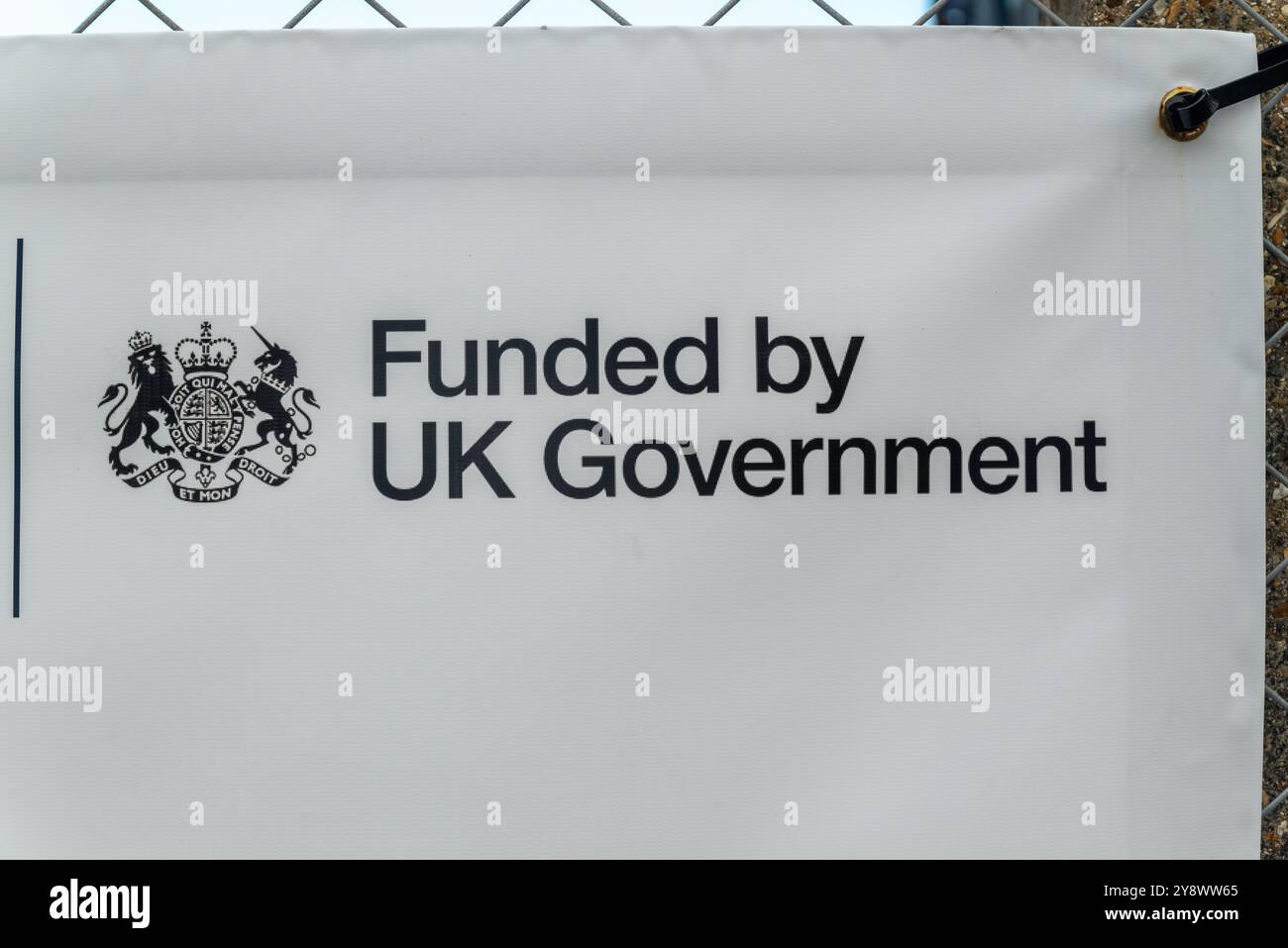 Sign outside of a building site, showing the project was funded by the ...