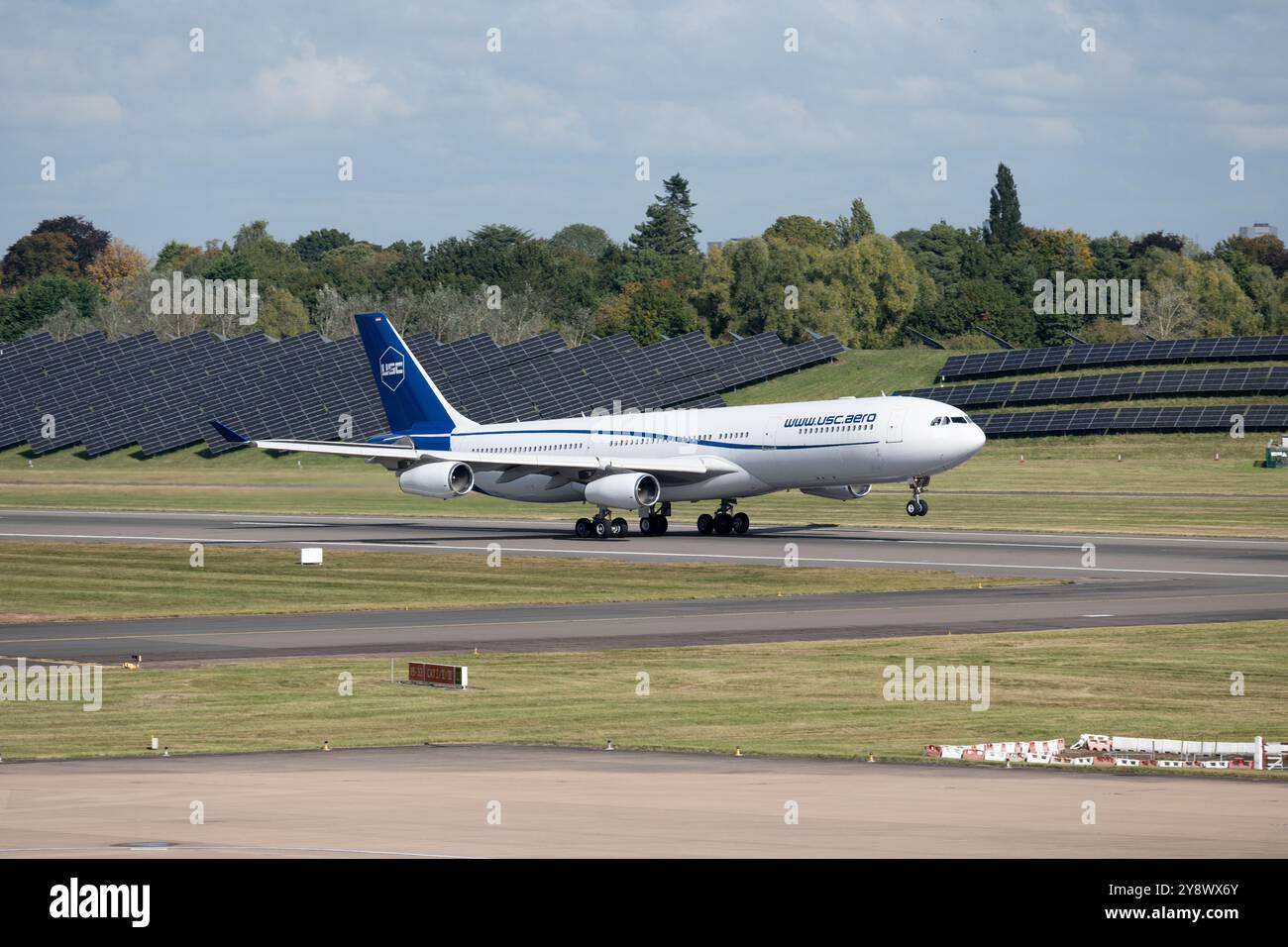 Universal Sky Carrier Airbus A340-313 taking off at Birmingham Airport ...