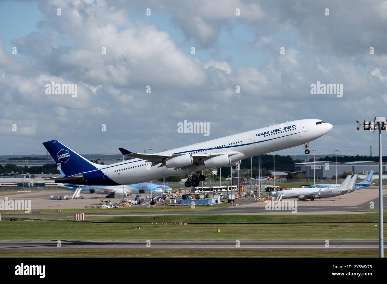 Universal Sky Carrier Airbus A340-313 taking off at Birmingham Airport ...