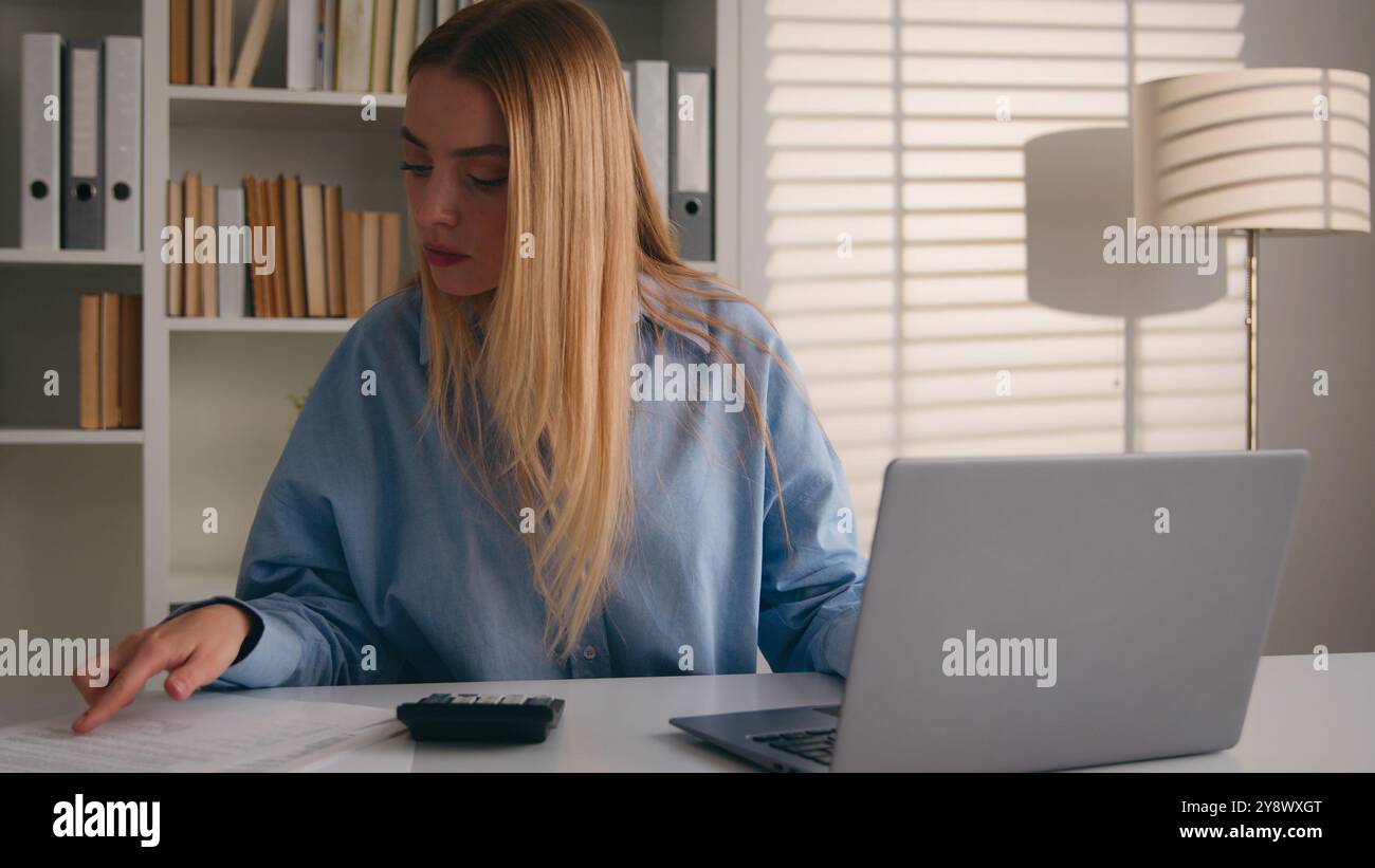 Confused puzzled Caucasian girl woman at office counting money business ...
