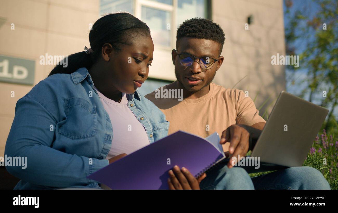 Two African American friends students discuss talking education project ...
