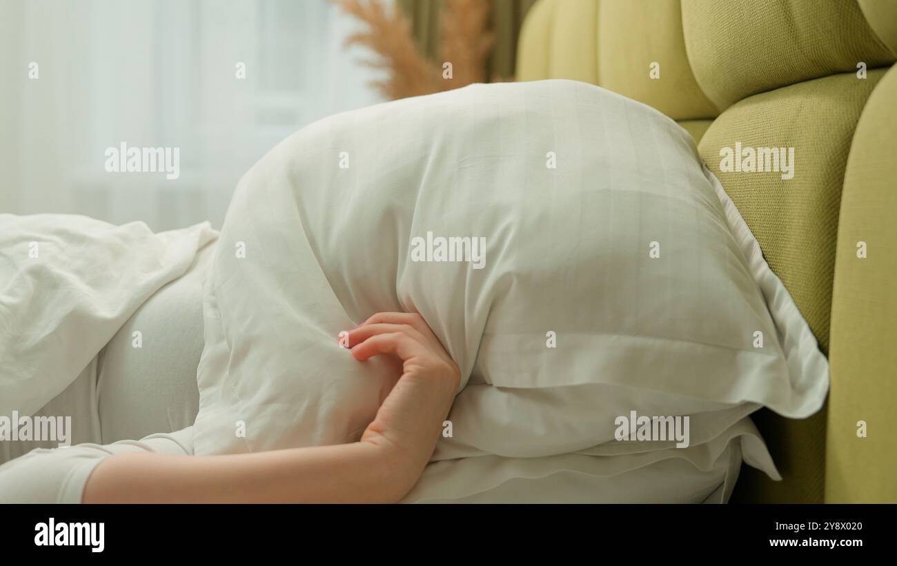 Angry annoyed girl wake up in morning bed home bedroom woman female ...