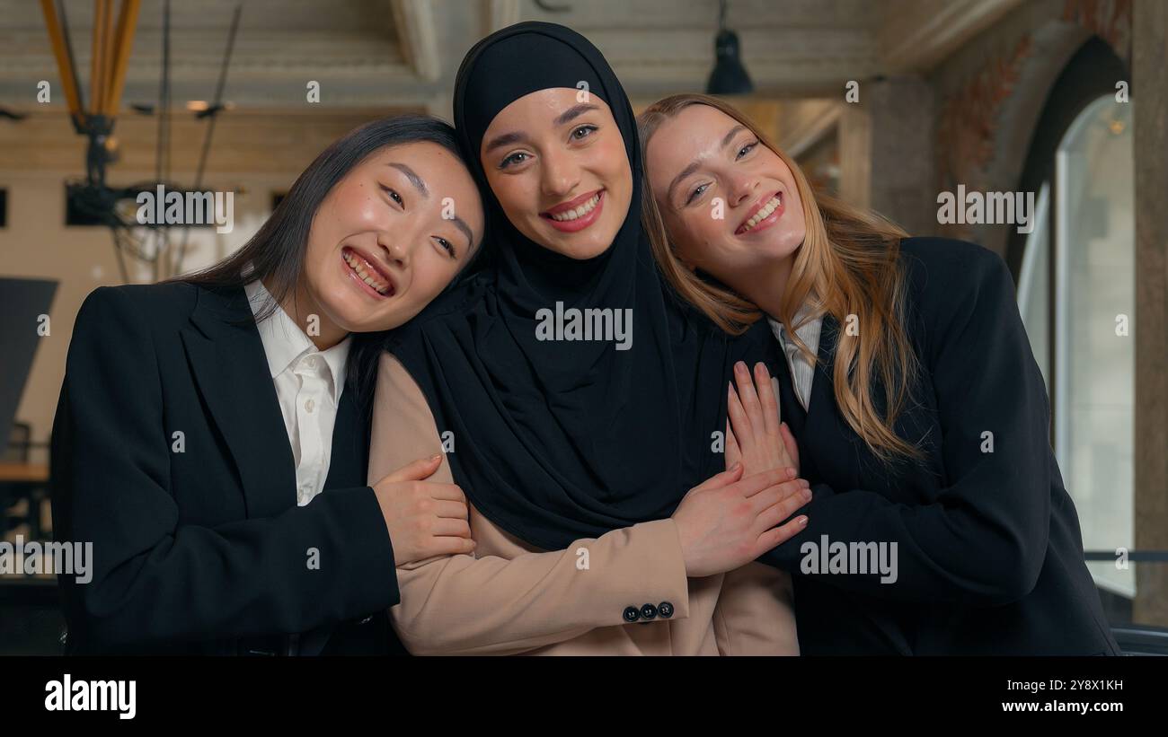 Friends diversity businesswomen support Arabian Islamic Muslim girl ...