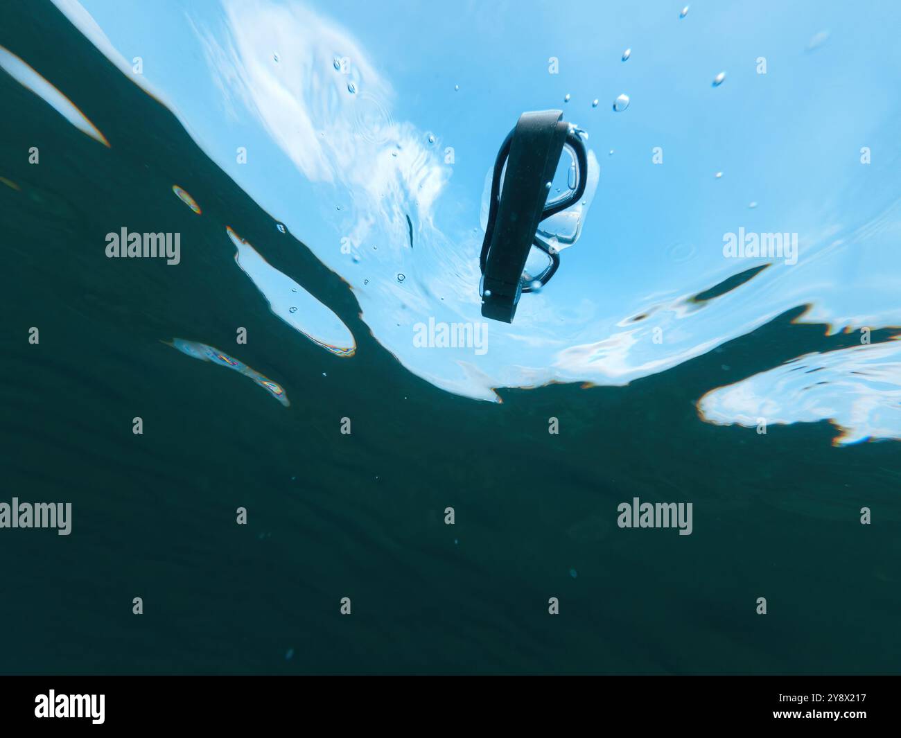 Scuba diving mask floating in ocean water, underwater shot with low ...