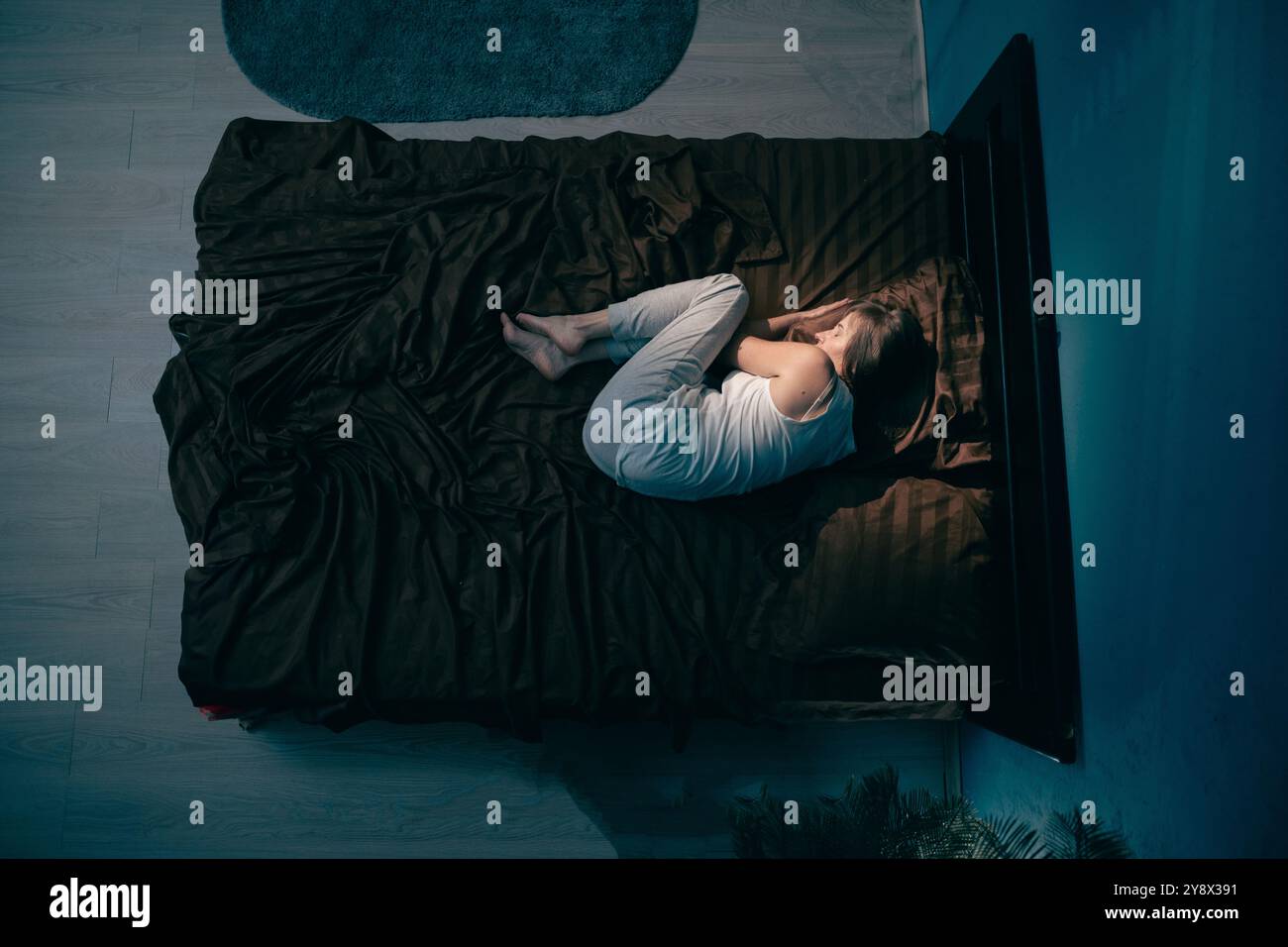 Rest at night concept. senior woman lying on one side sleeps in bed ...