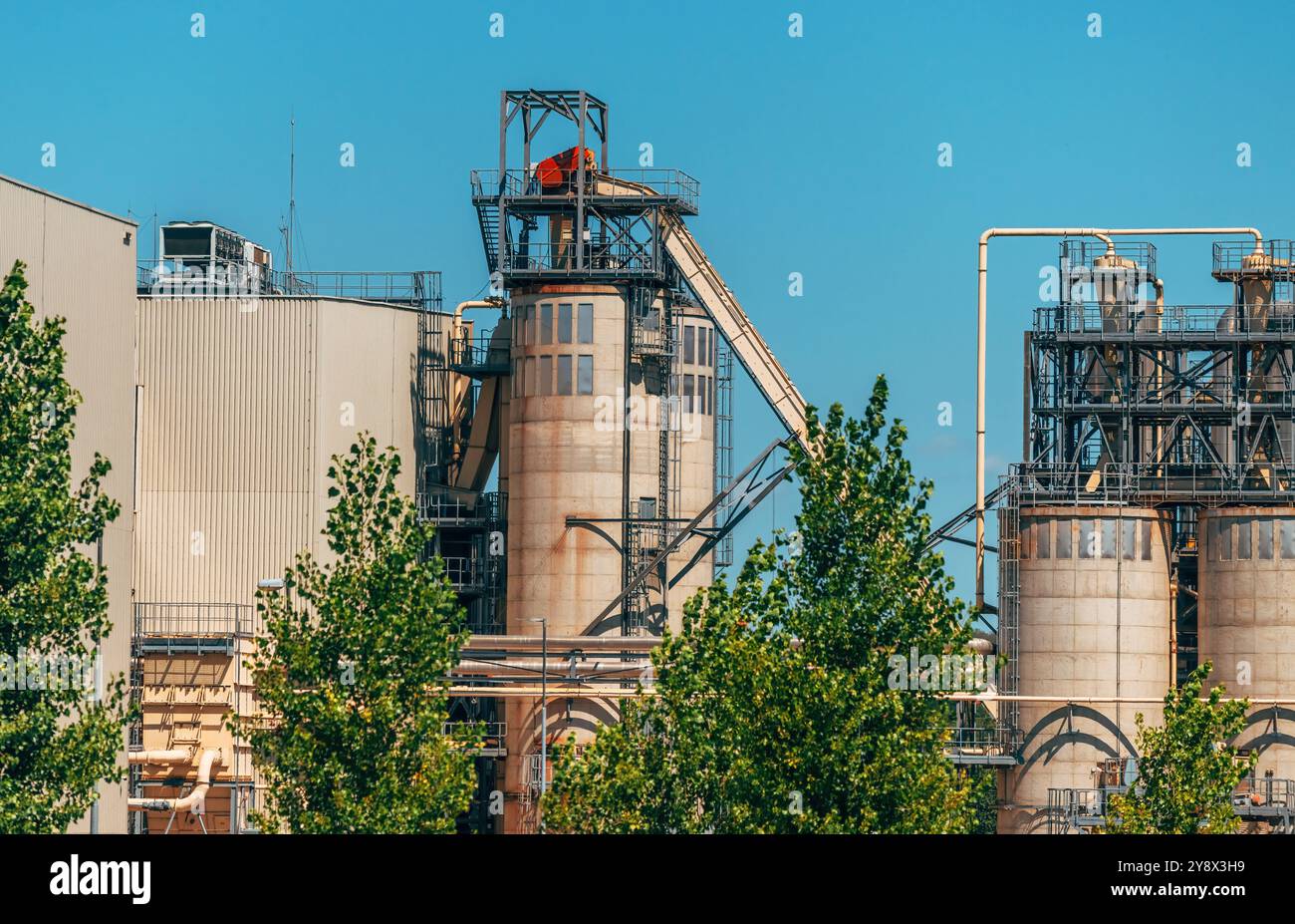 Wood processing plant exterior, timber industry building with tree ...