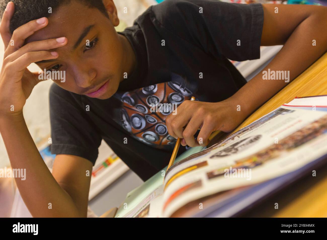 Boy doing homework Stock Photo - Alamy