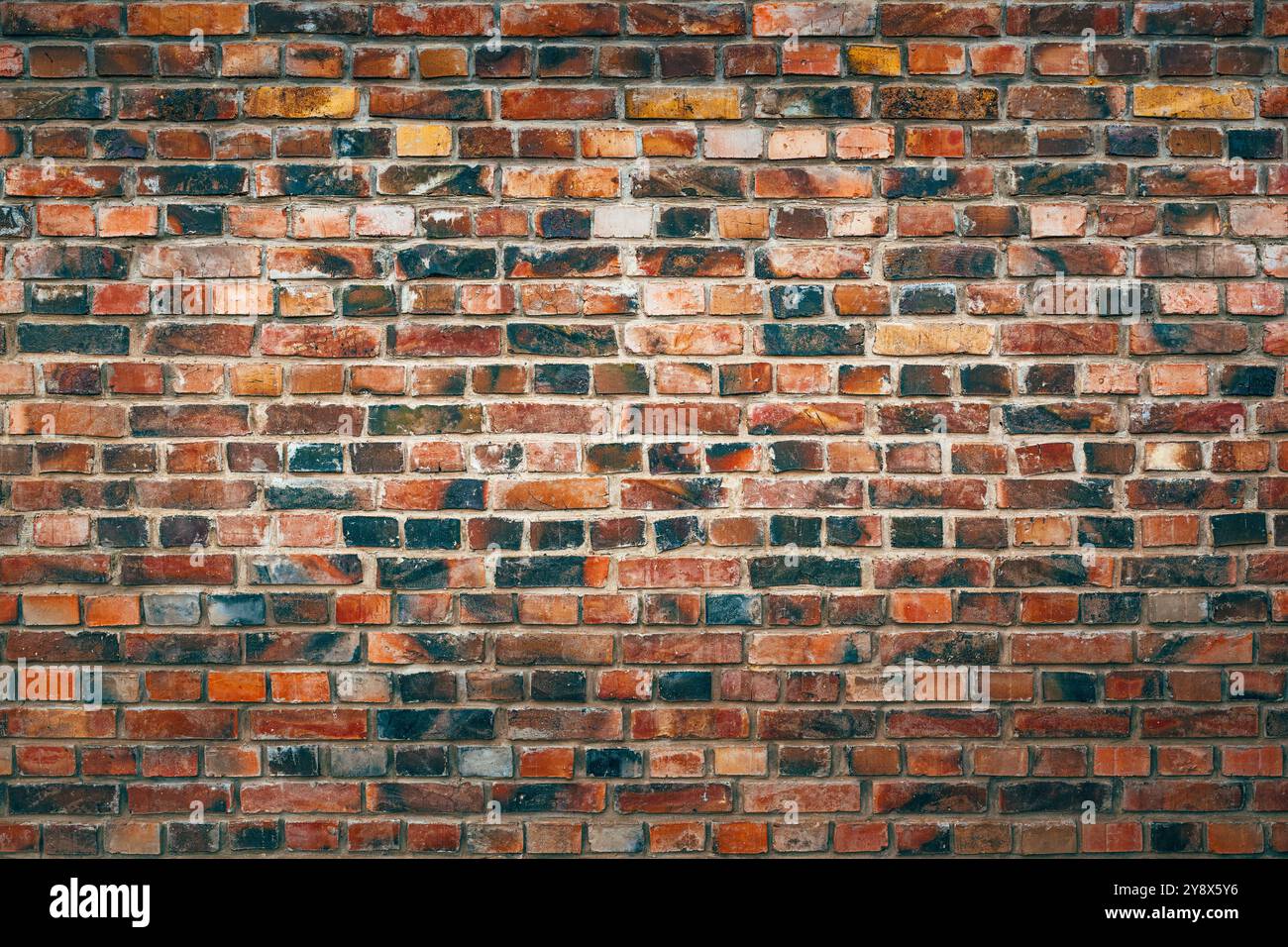 Texture of a beautiful clinker brick wall pattern. Rustic facade with vibrant color and unique ...